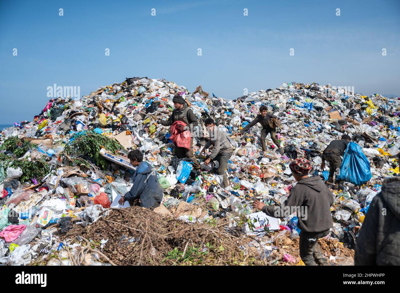 Beirut, Lebanon. 18th Feb, 2022. Day laborers collect recyclable items ...