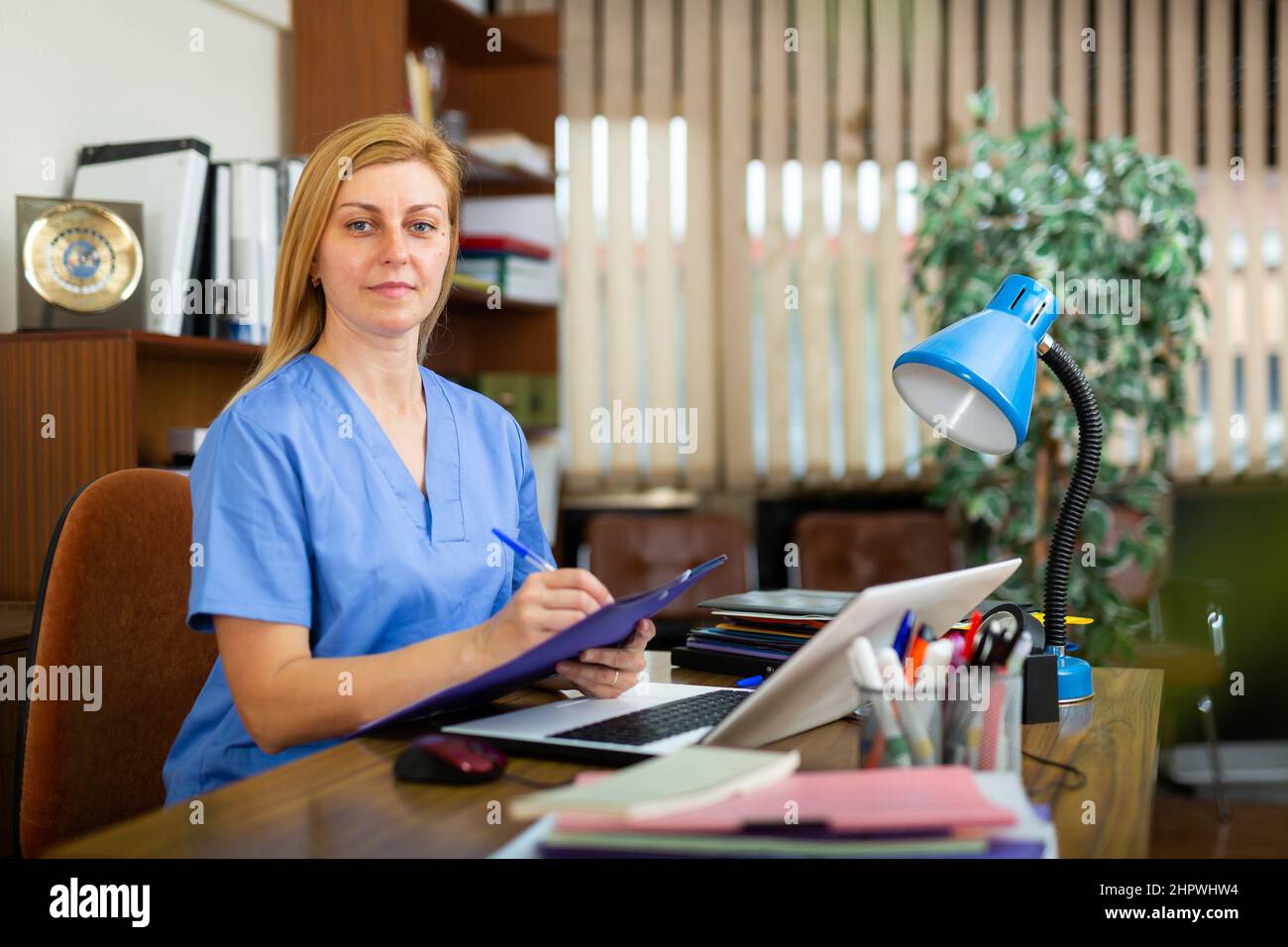 Doctor works in front of computers in private clinic Stock Photo - Alamy