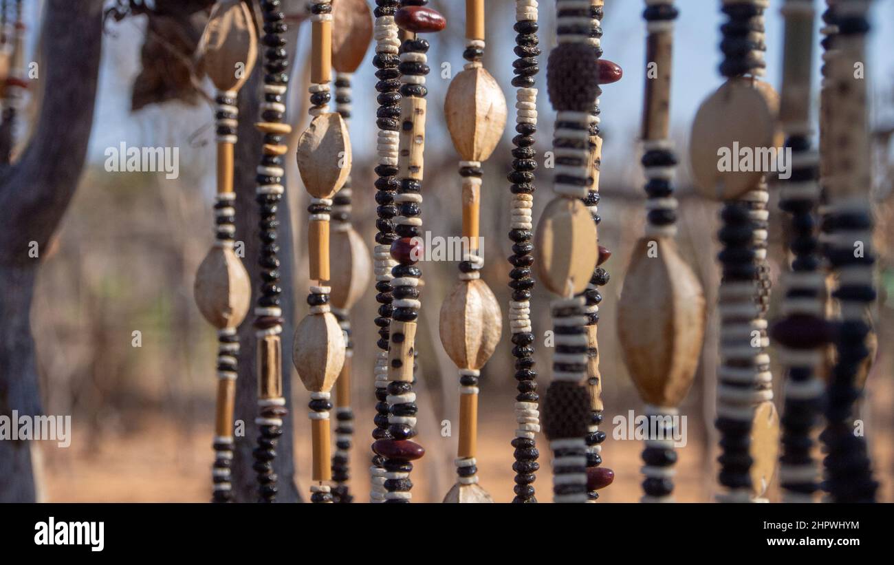 Close up of strings of African necklaces made from beads and seeds on ...