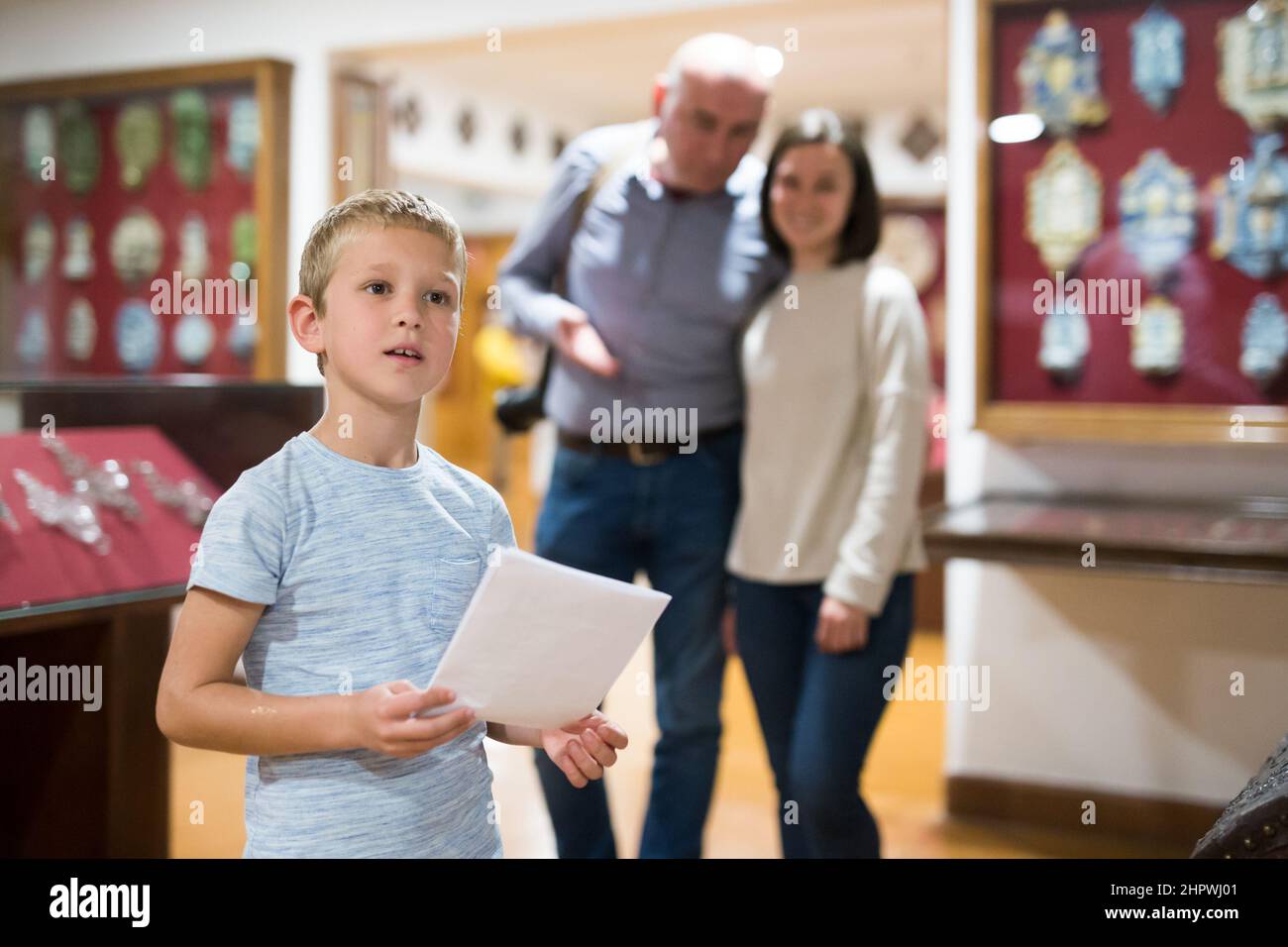 Family visiting museum Stock Photo - Alamy
