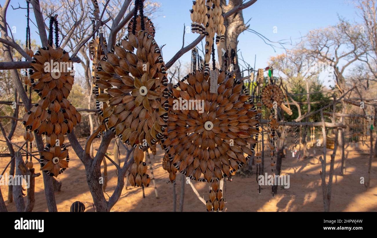 African necklaces shaped like flowers made from seeds and beads on ...