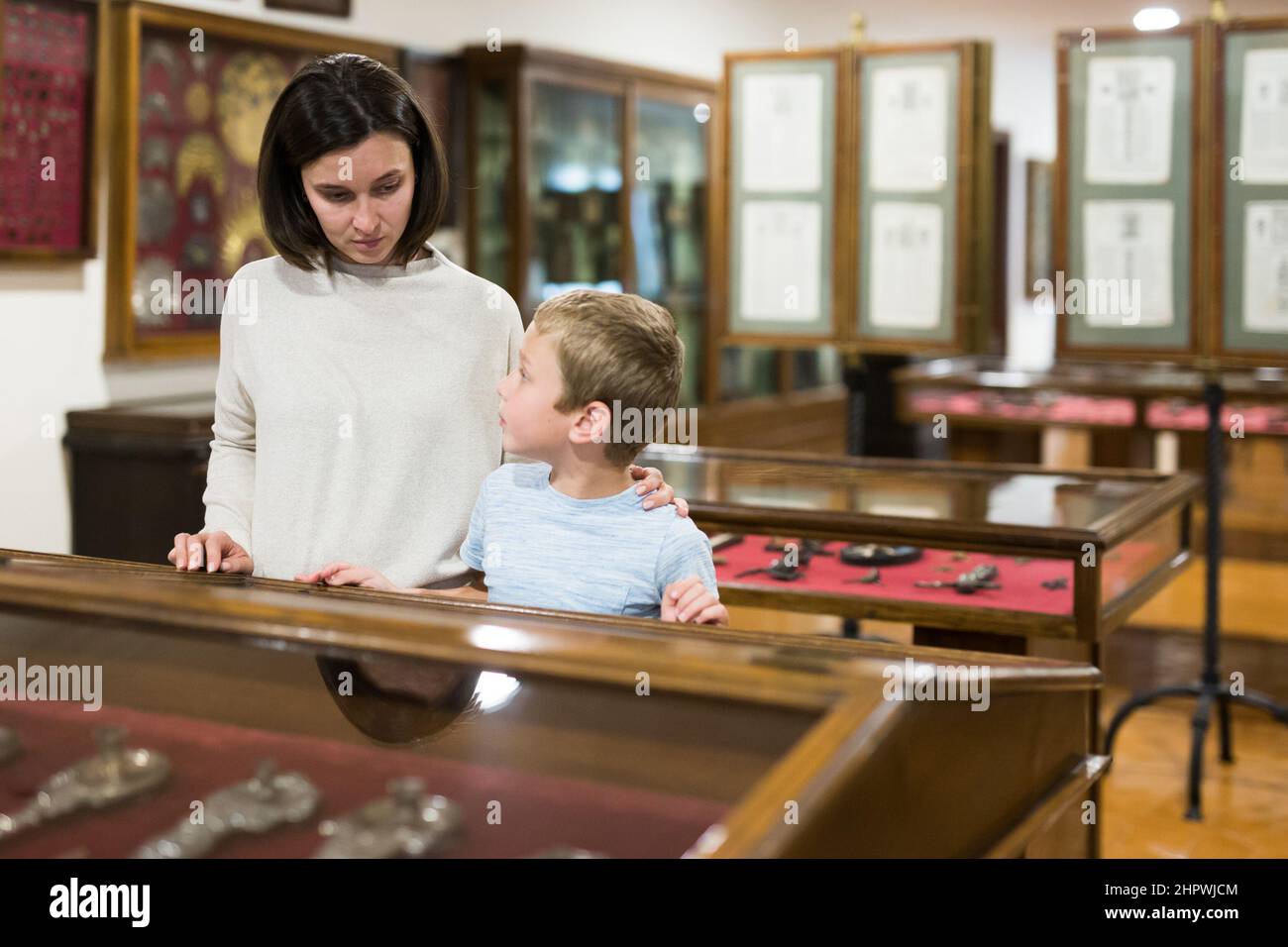 Woman and boy exploring artworks in museum Stock Photo - Alamy