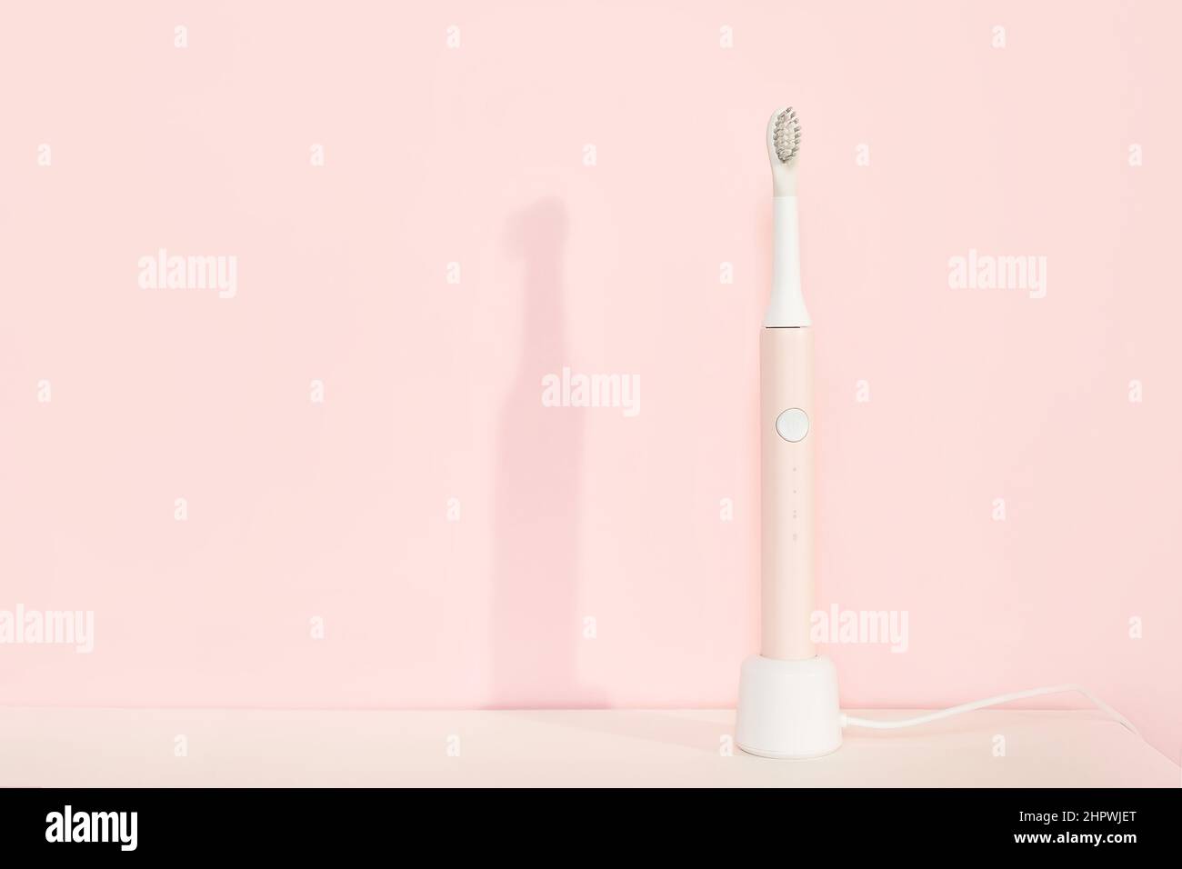 New modern ultrasonic toothbrush. Jaw model and dental care supplies on ...