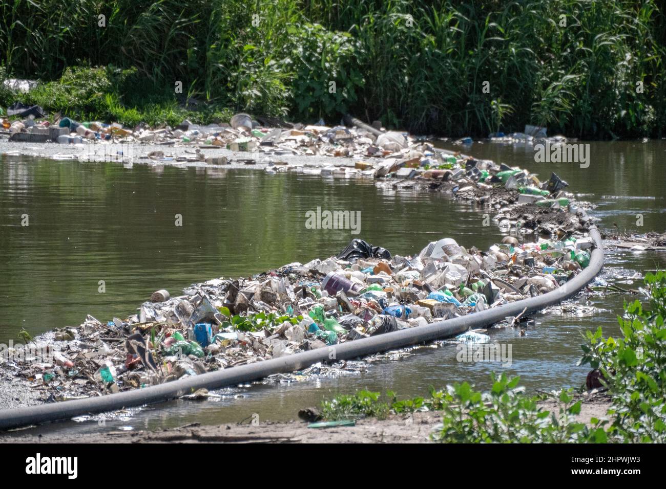 Floating litter boom from the Litter Boom Project used to collect ...