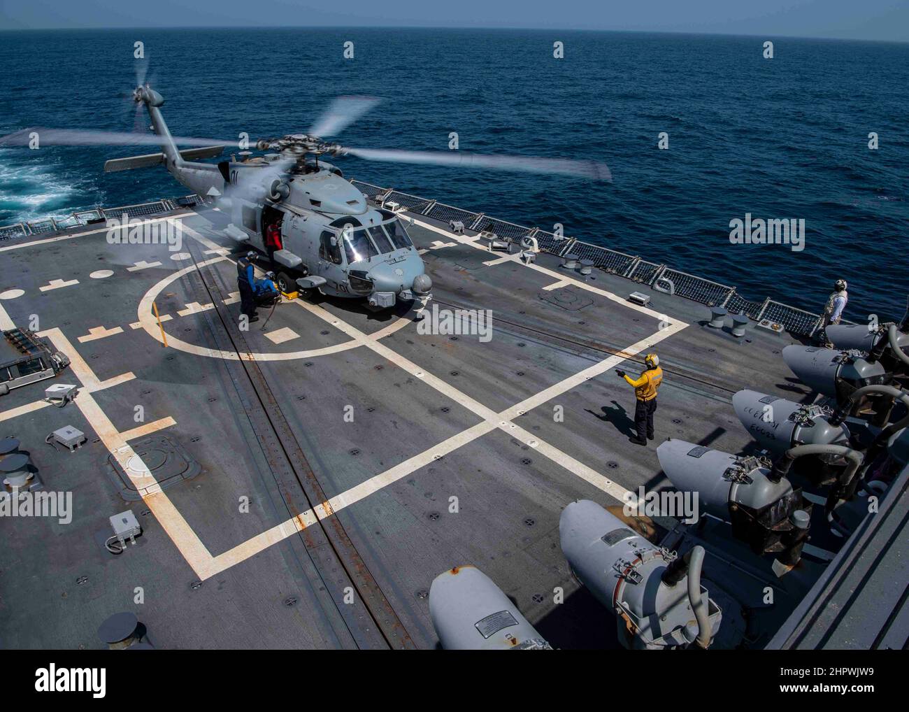 GULF OF OMAN (Feb. 23, 2022) Seaman Nicholas Steinhaus, middle, directs ...