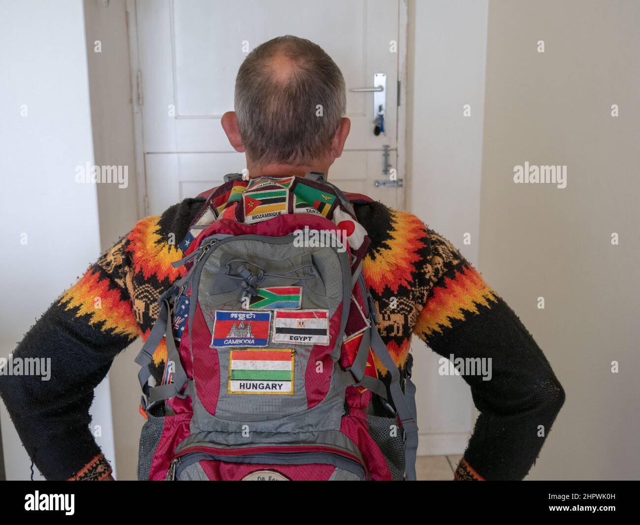 Man in wheelchair getting ready to travel. He is leaving the house ...