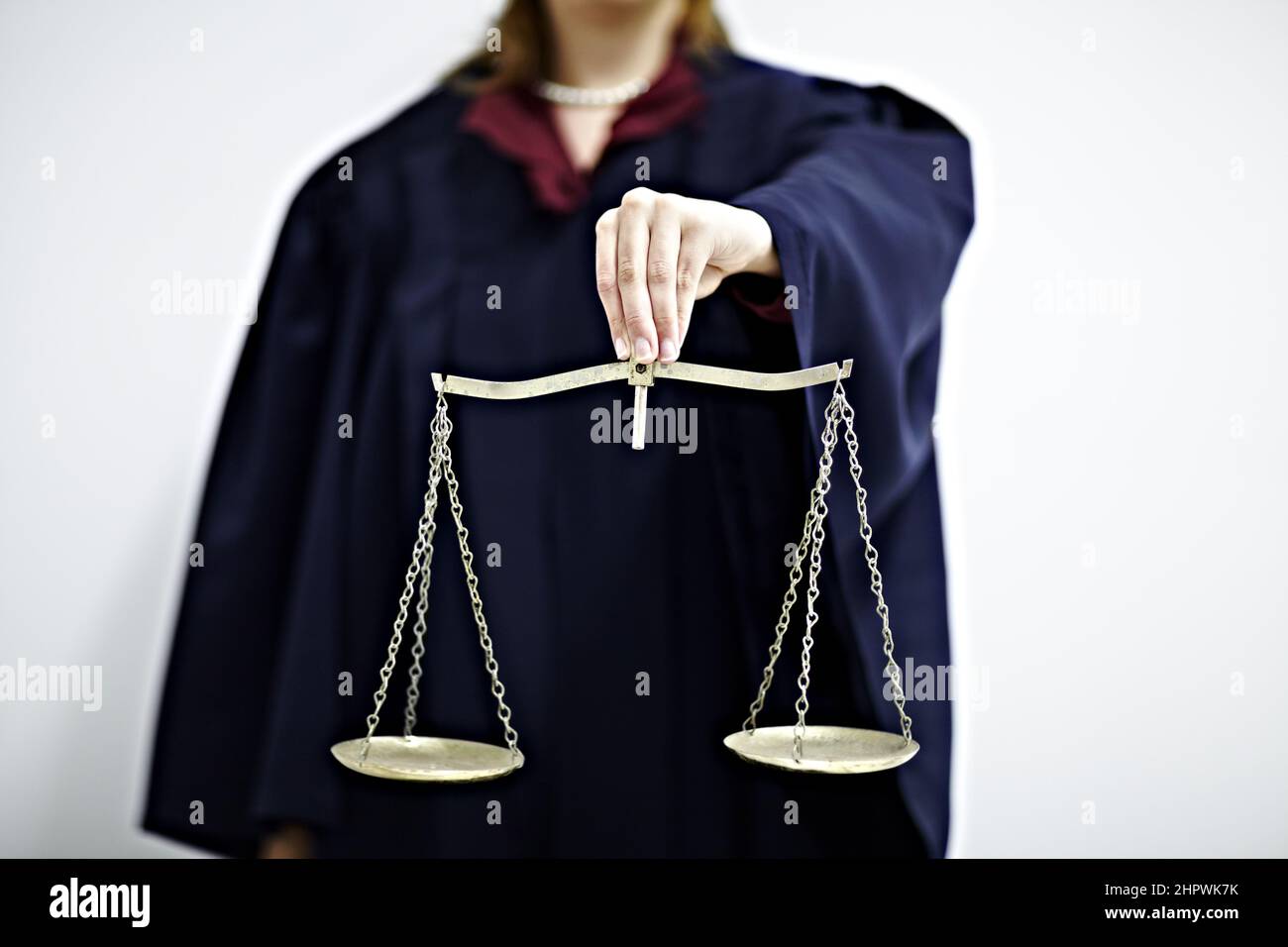 The scales of justice. Conceptual image of a judge holding a scale ...