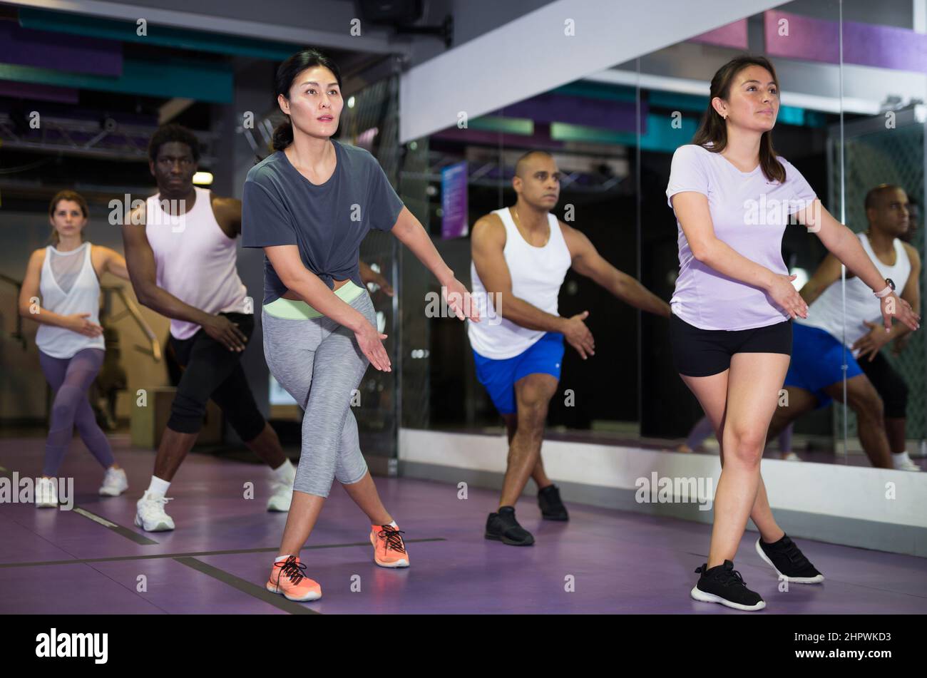 Group of people practicing together in gym Stock Photo - Alamy