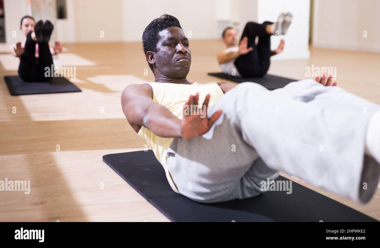 Group performing fitness exercises hi-res stock photography and images ...