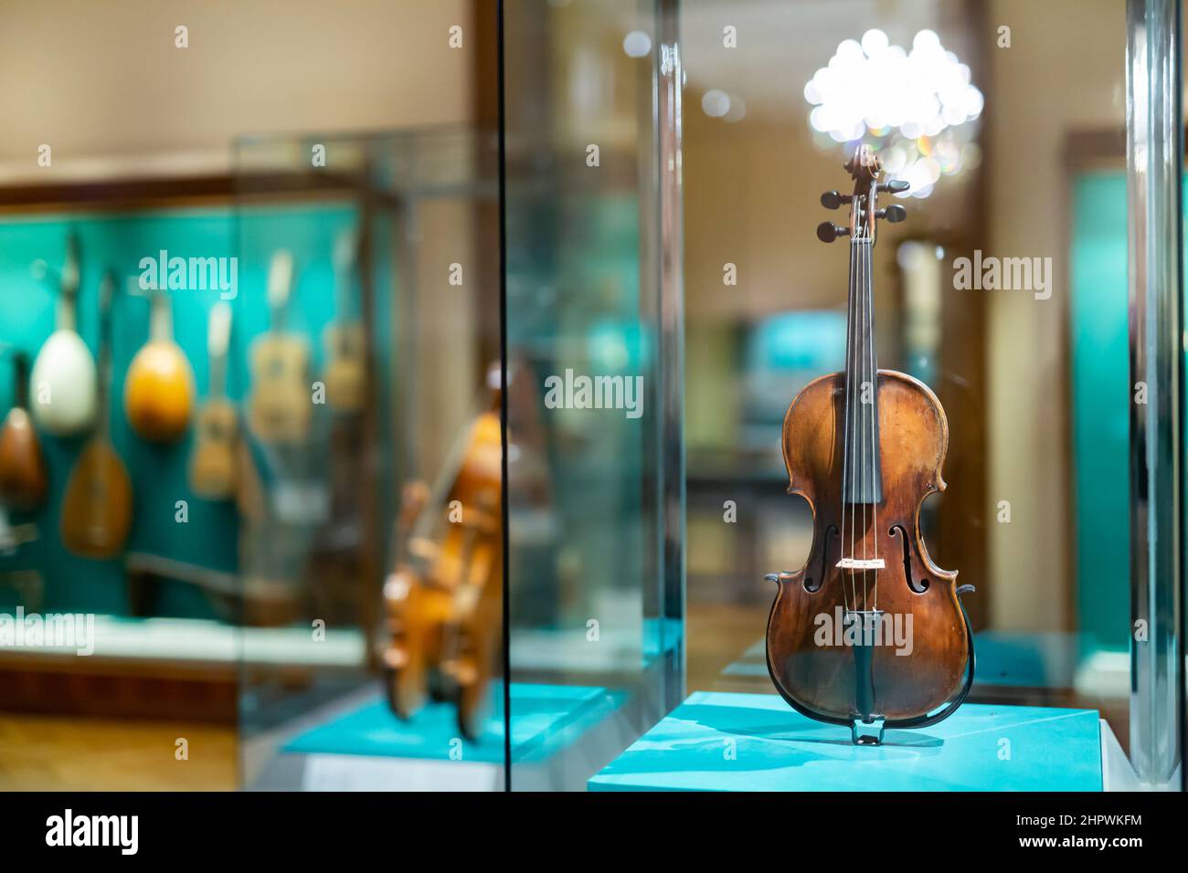 Showcase with old violin in Weltmuseum Wien, Austria Stock Photo - Alamy
