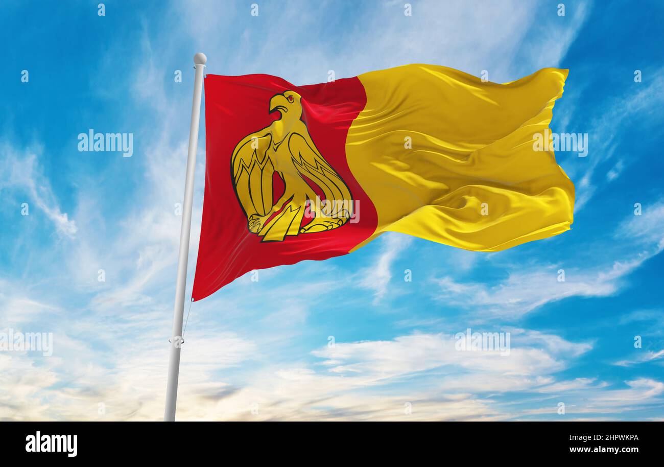 flag of Kirovohrad region , Ukraine at cloudy sky background on sunset ...