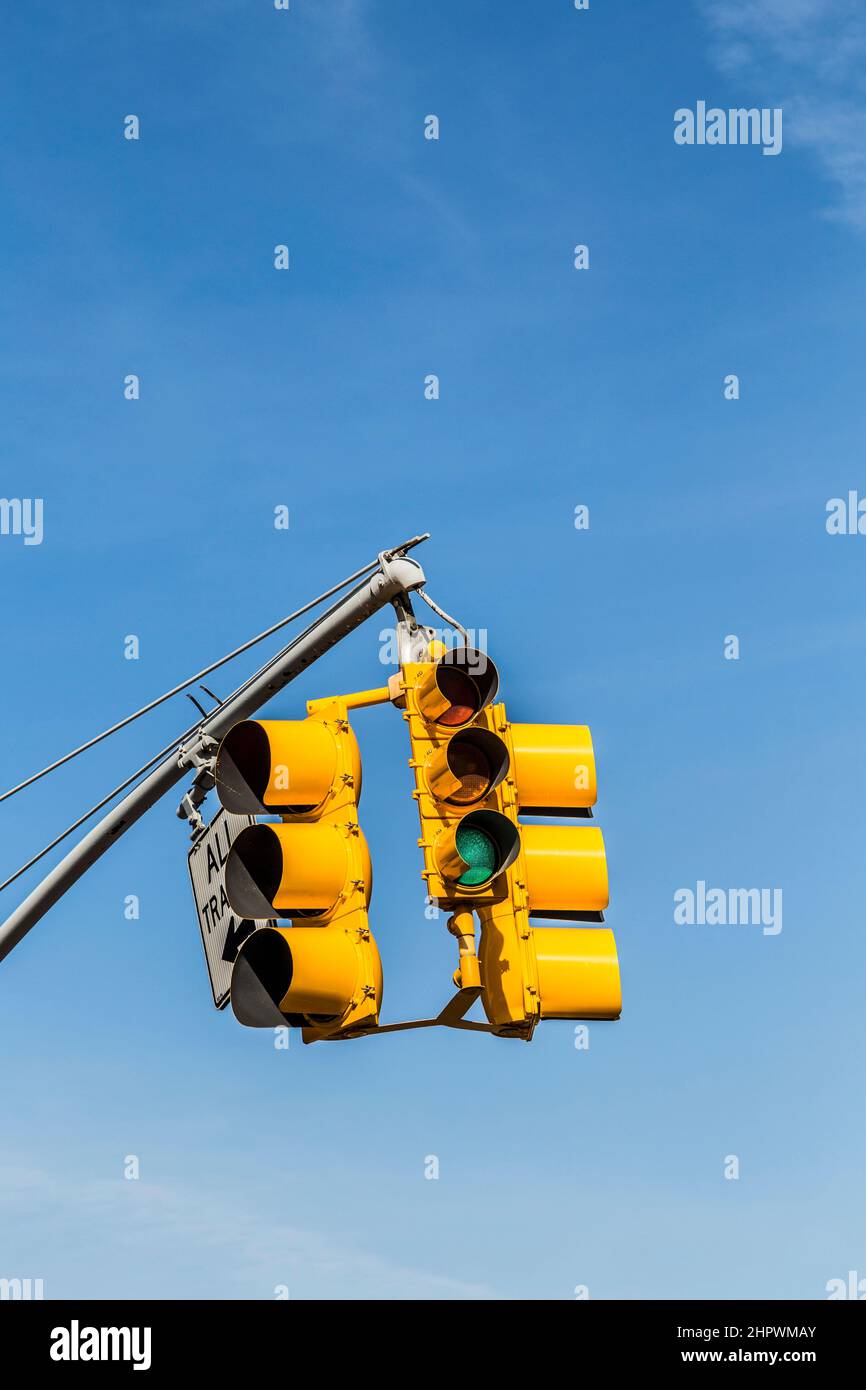 Blue sky and green hanging sign hi-res stock photography and images - Alamy