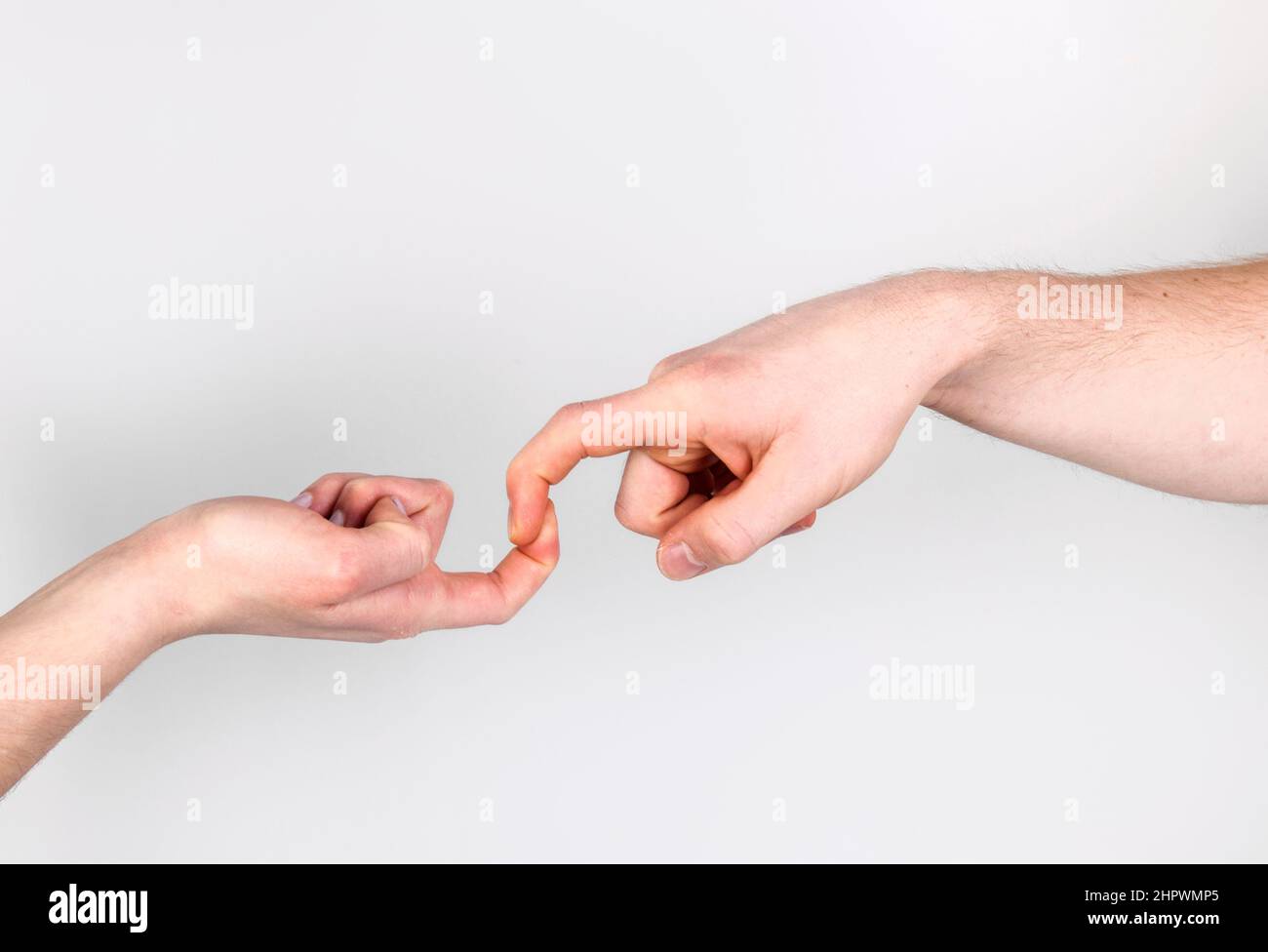Two index fingers touching hi-res stock photography and images - Alamy