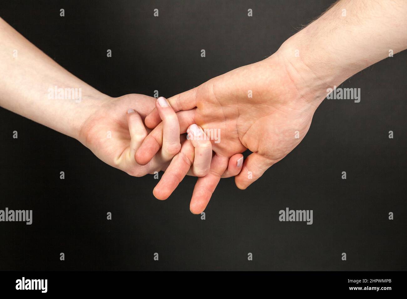 Couple holding hands tenderly hi-res stock photography and images - Alamy