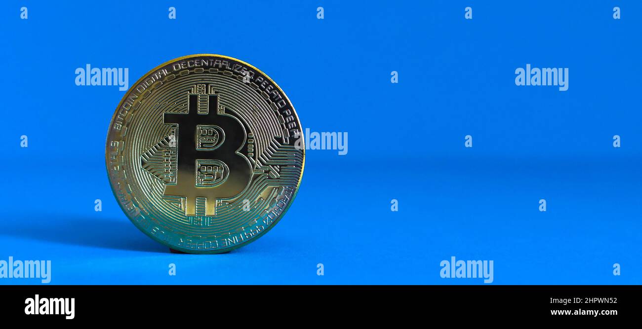 Bitcoin BTC crypto currency gold coin on blue background, new virtual ...
