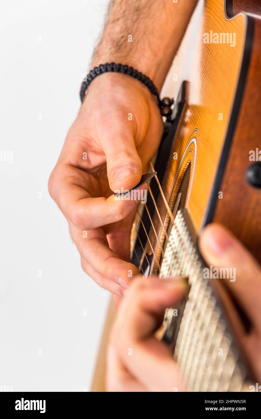 detail of fingers, string and hand of guitar player Stock Photo - Alamy