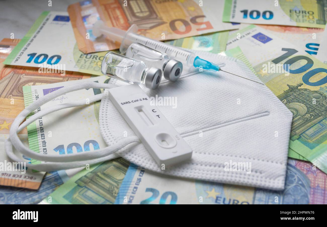 Money (Euro currency banknotes) with medical mask, antigen test ...