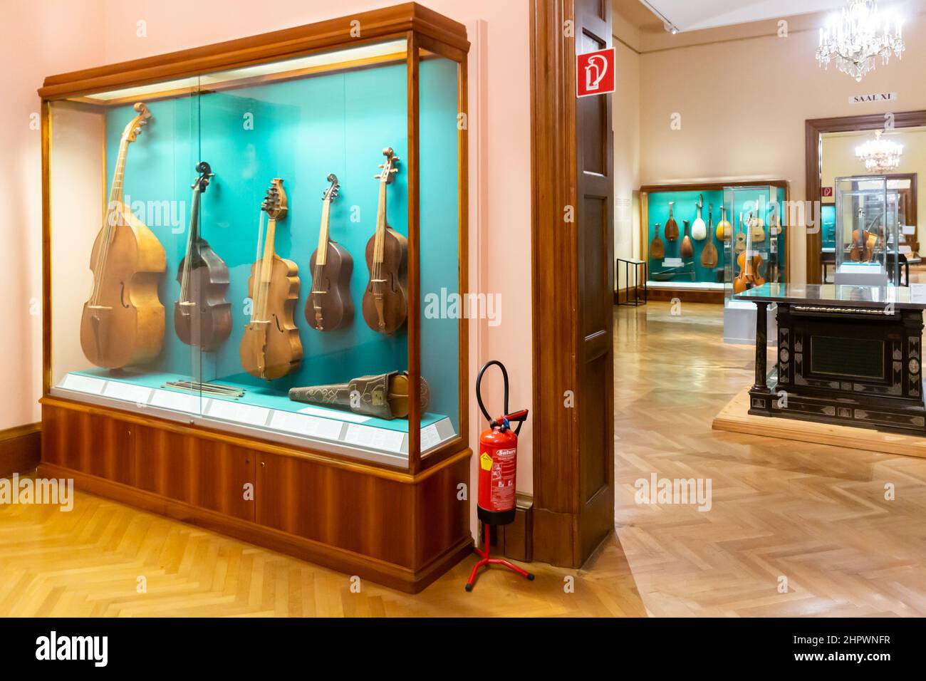 Showcase with bowed string instruments in Weltmuseum Wien, Austria ...