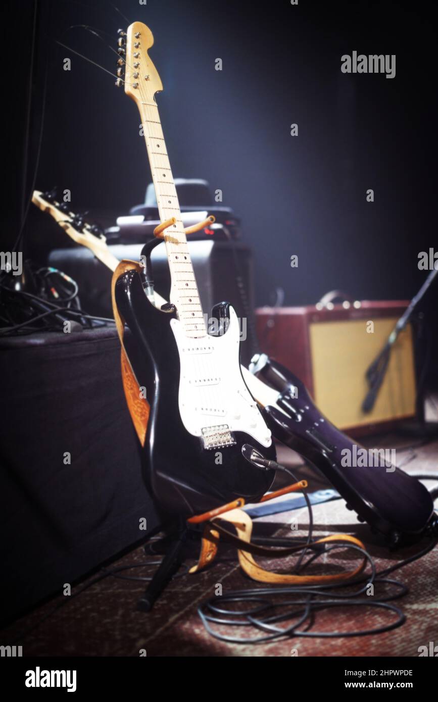 Behind the scenes at a gig. Electric guitars set up on a stage Stock ...