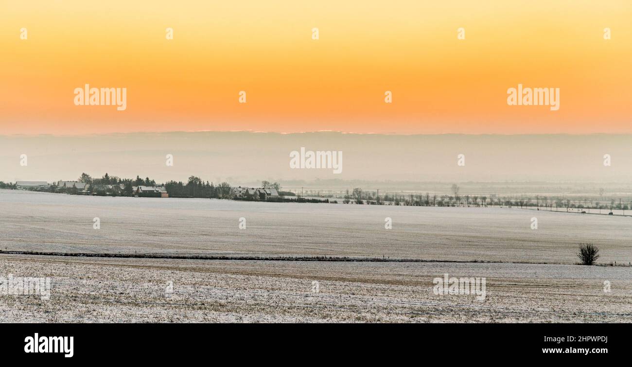 scenic sunrise in snow covered winter landscape in Thuringia, Germany ...