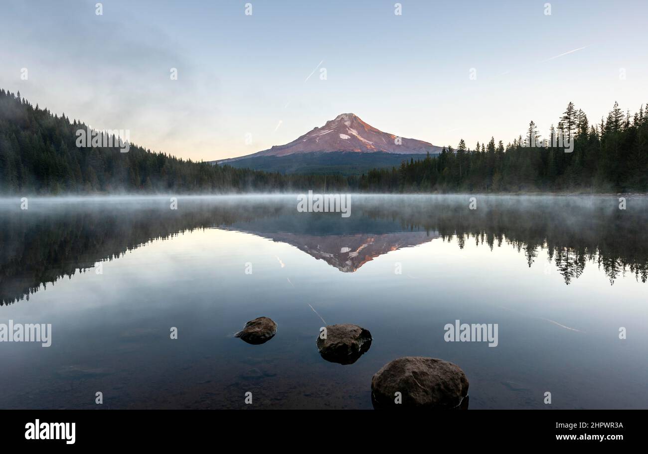 Three stones in the water, reflection of the volcano Mt. Hood in the ...