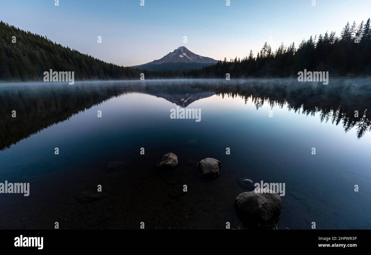 Three stones in the water, reflection of the volcano Mt. Hood in the ...