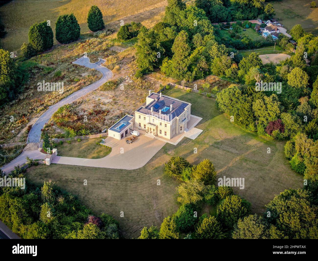 Aerial view of a huge mansion surrounded by trees Stock Photo - Alamy