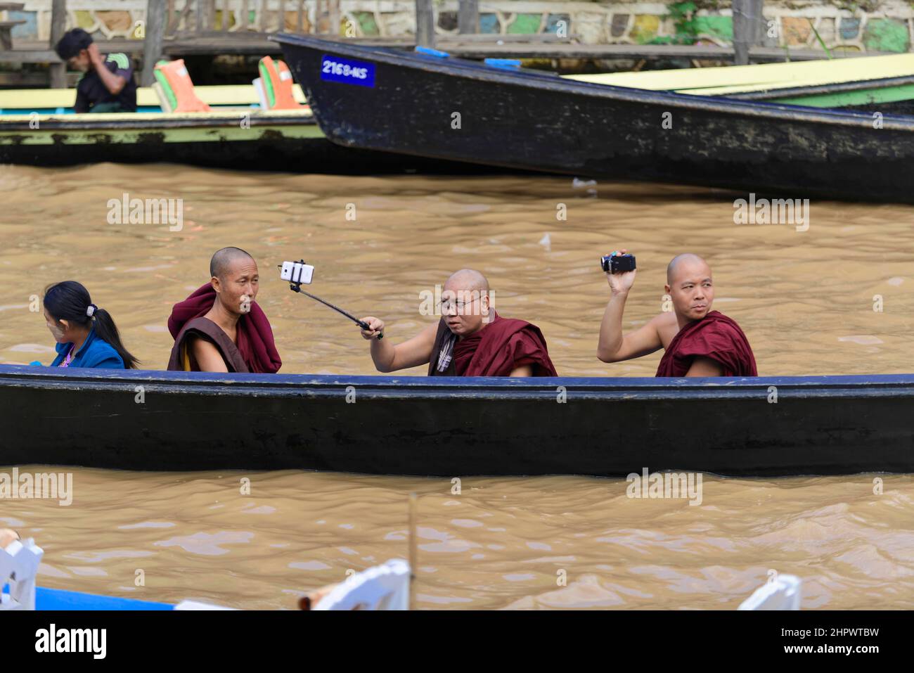 Monks with mobile phones, boats on Inle Lake, Nyaung Shwe, Shan State ...
