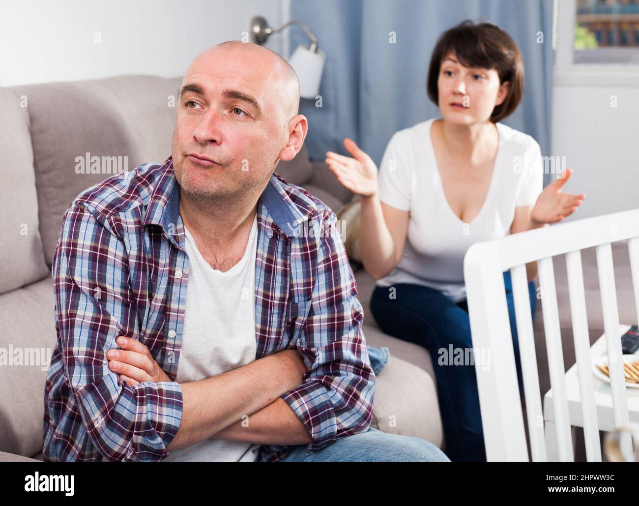 Sad family having difficulties in the living room at home Stock Photo ...