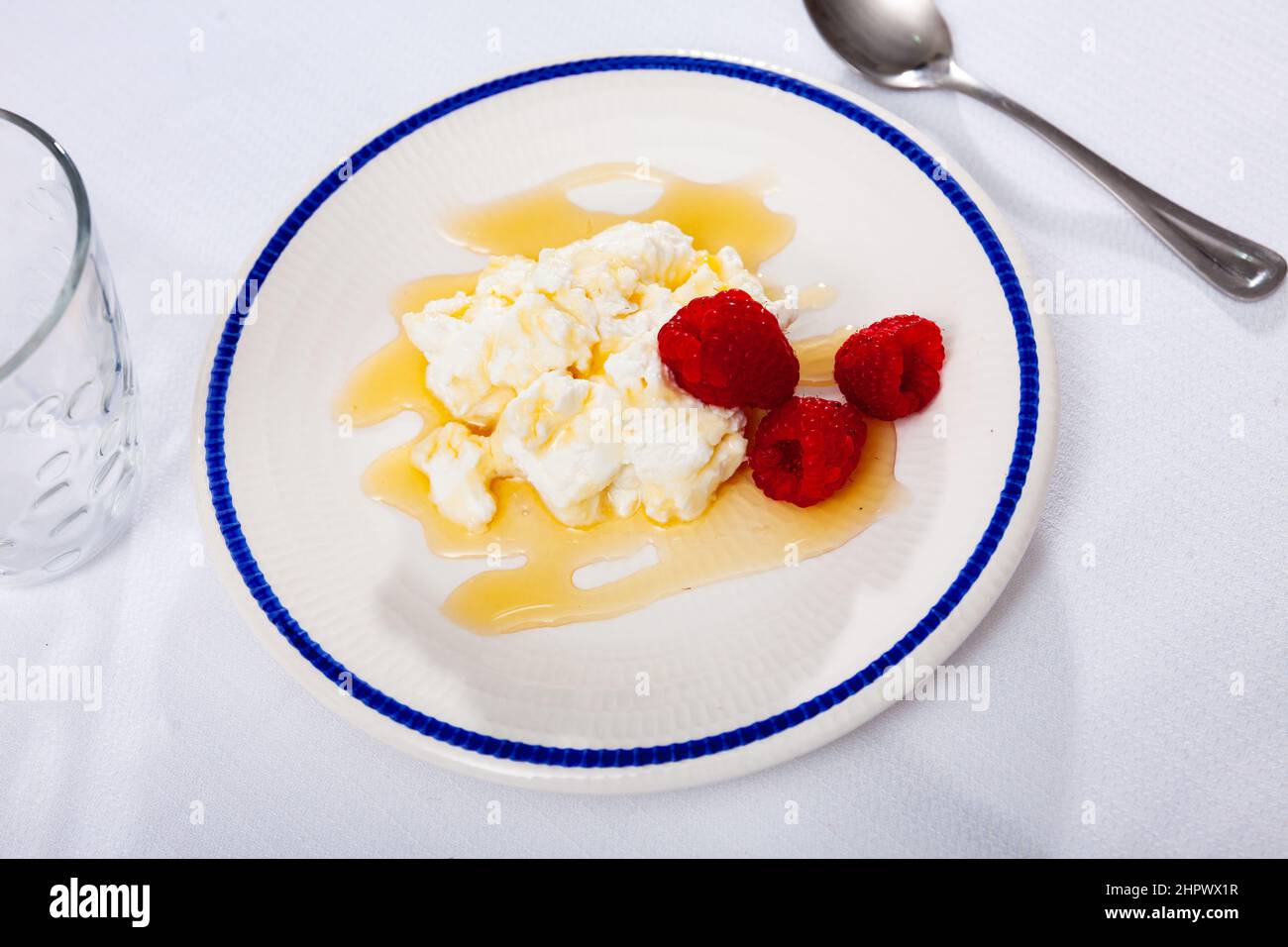Mato cheese with raspberry and honey Stock Photo - Alamy