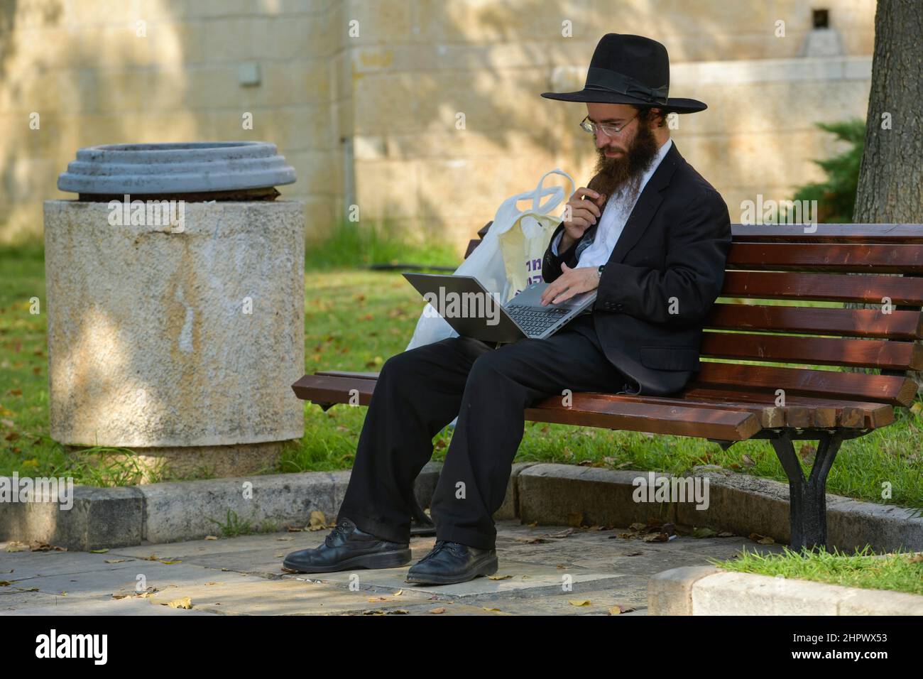 Orthodox Jew in the park with laptop, Jerusalem, Israel Stock Photo - Alamy