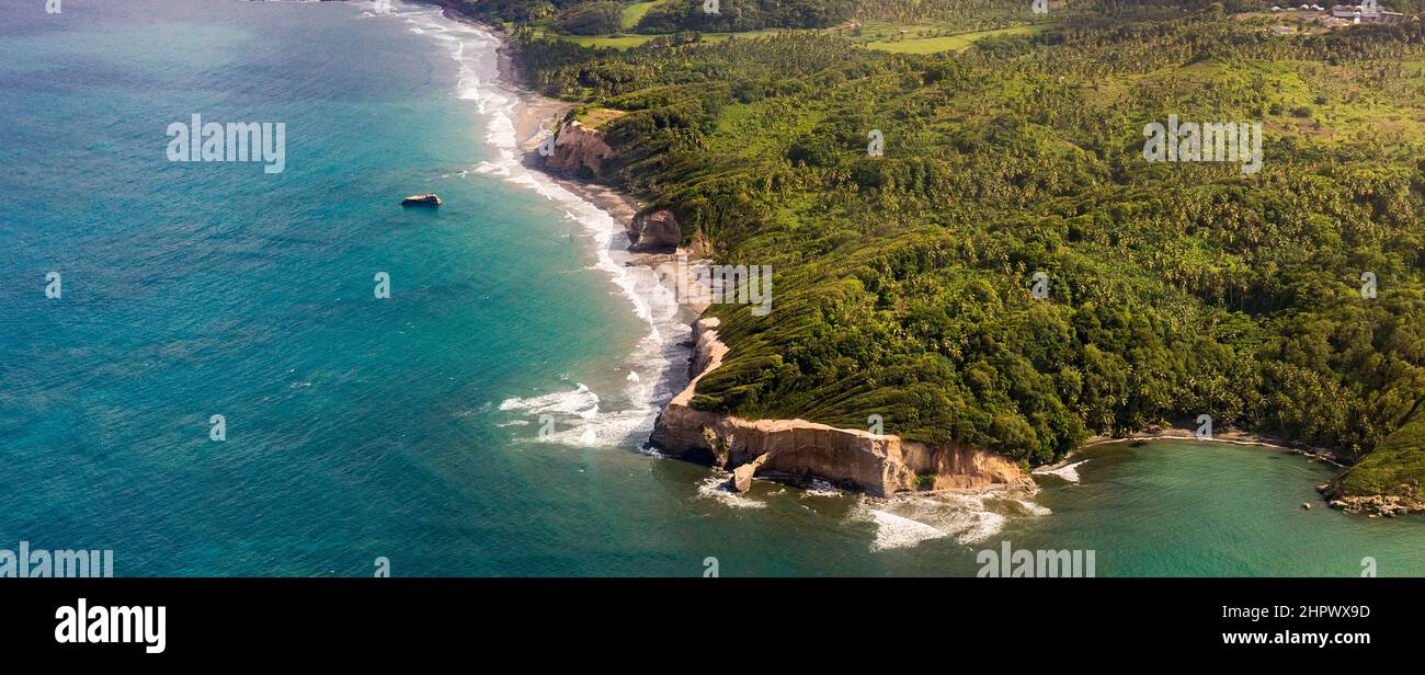 aerial of green jungle, coast and ocean in Dominica Stock Photo - Alamy