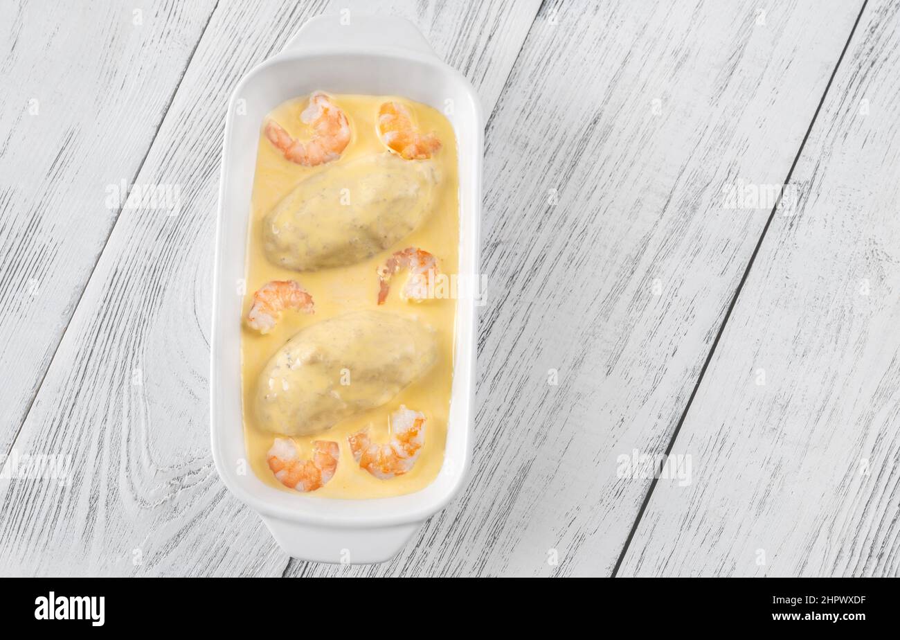 Quenelle - creamed fish mixture with Hollandaise sauce Stock Photo - Alamy