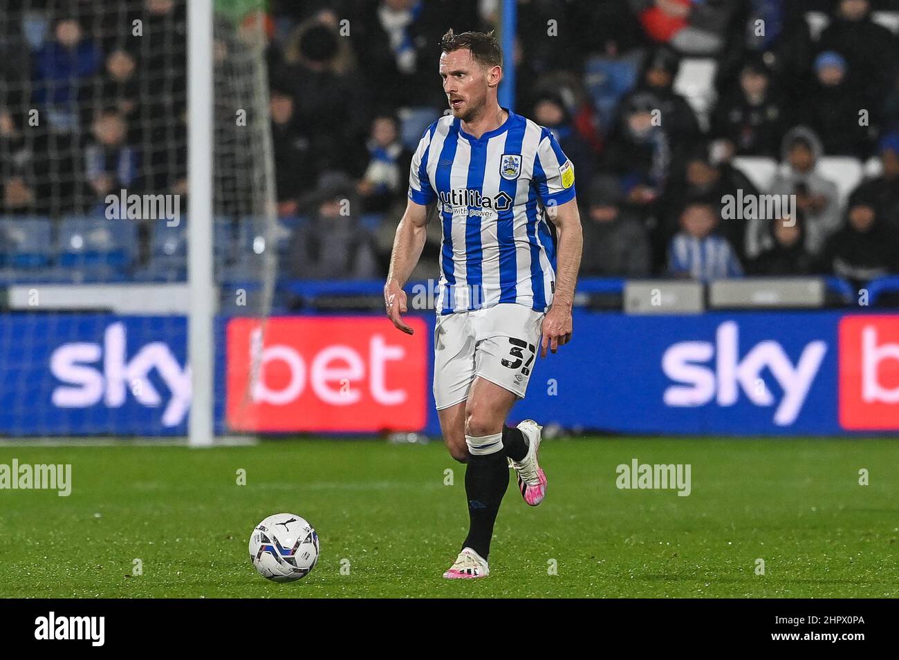 Tom Lees #32 of Huddersfield Town makes a break with the ball Stock ...