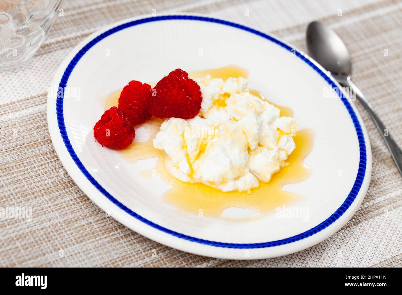 Mato cheese with raspberry and honey Stock Photo - Alamy