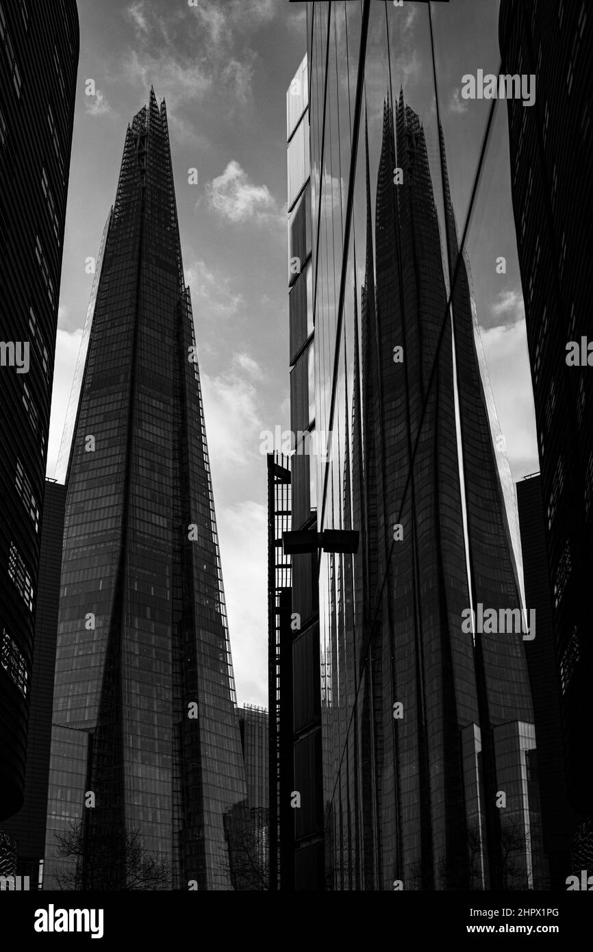 Vertical low angle grayscale shot of the Shard London and it's ...