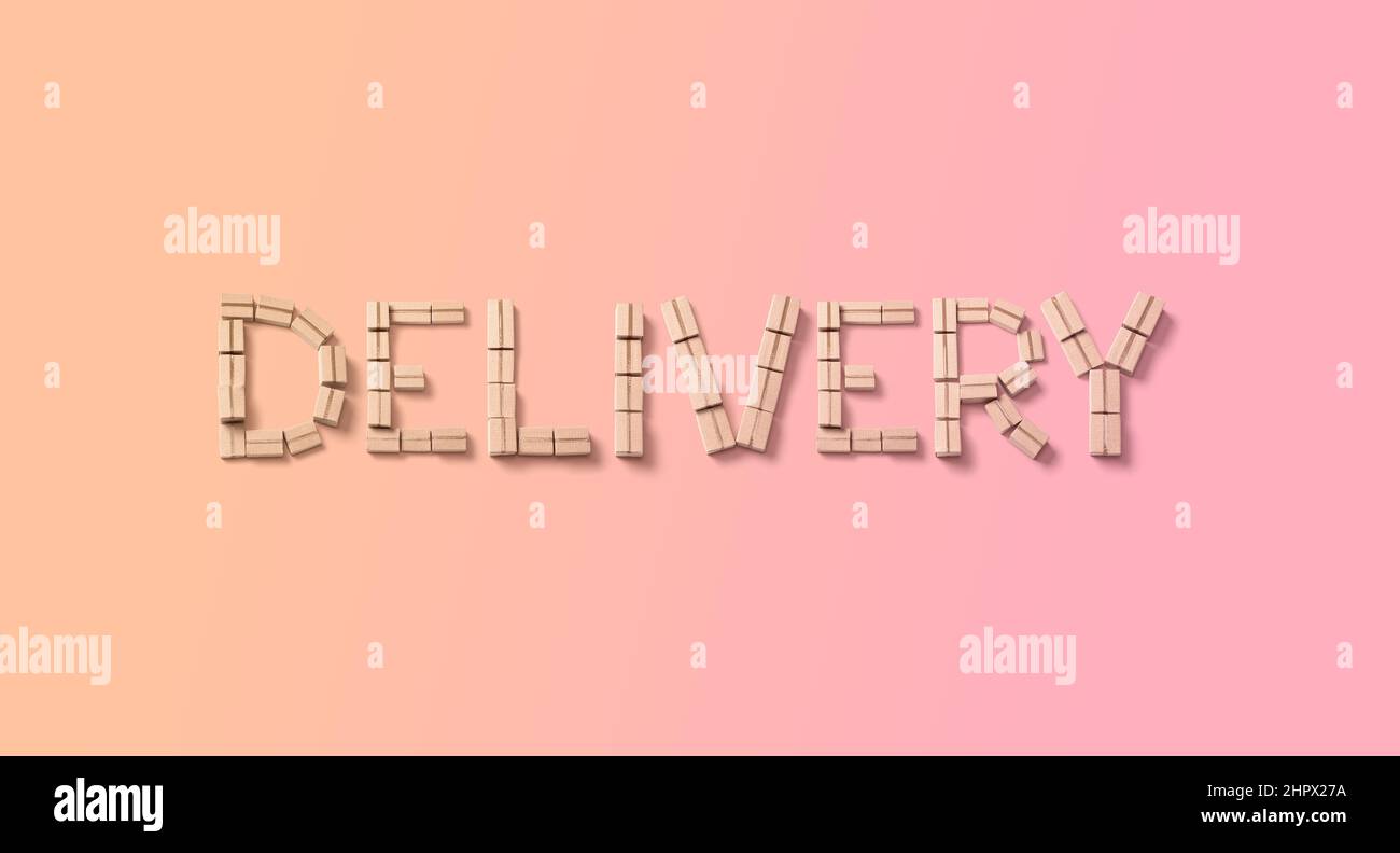 Word DELIVERY from cardboard boxes on pink background Stock Photo - Alamy