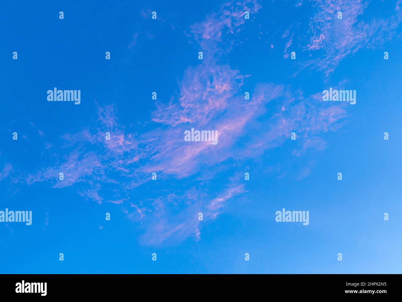 blue sky in sunset with light red clouds in sunset light Stock Photo ...