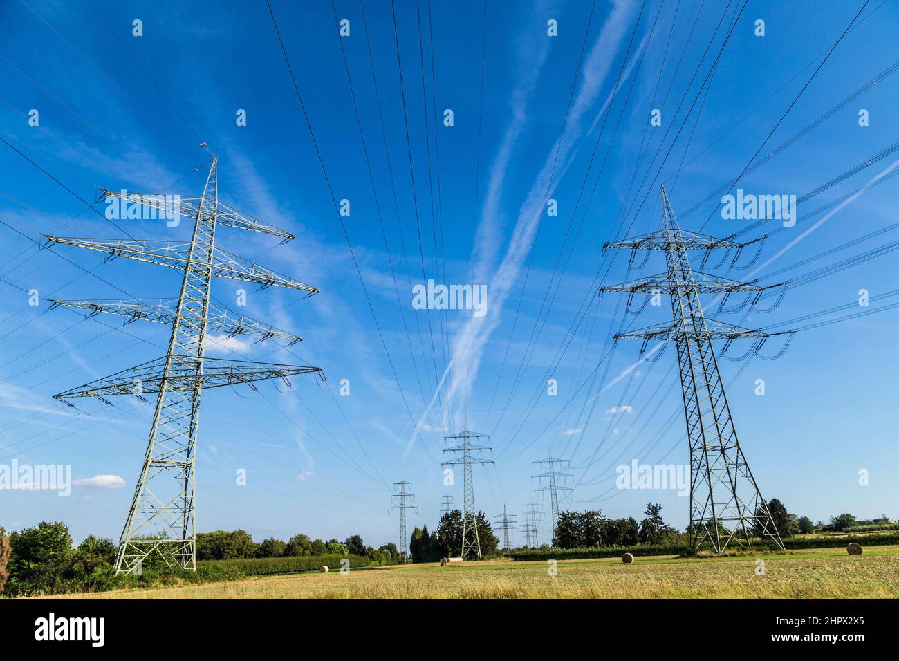 Impressive electric pylons transporting electricity through high ...