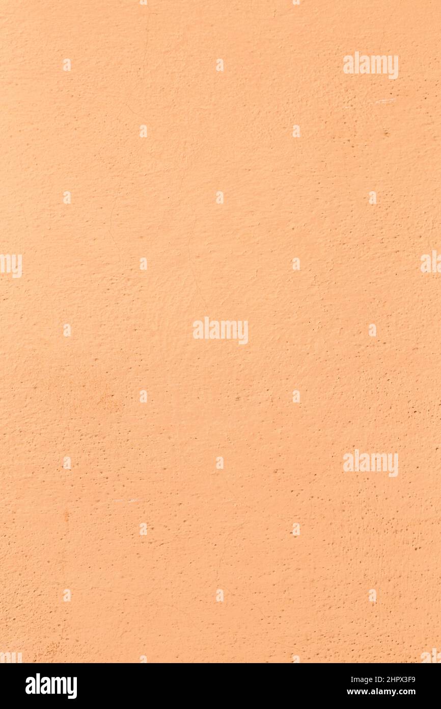 soft orange wall background in uni color Stock Photo - Alamy