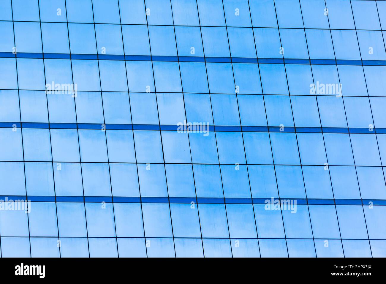 Blue glass windows of office building for background Stock Photo - Alamy