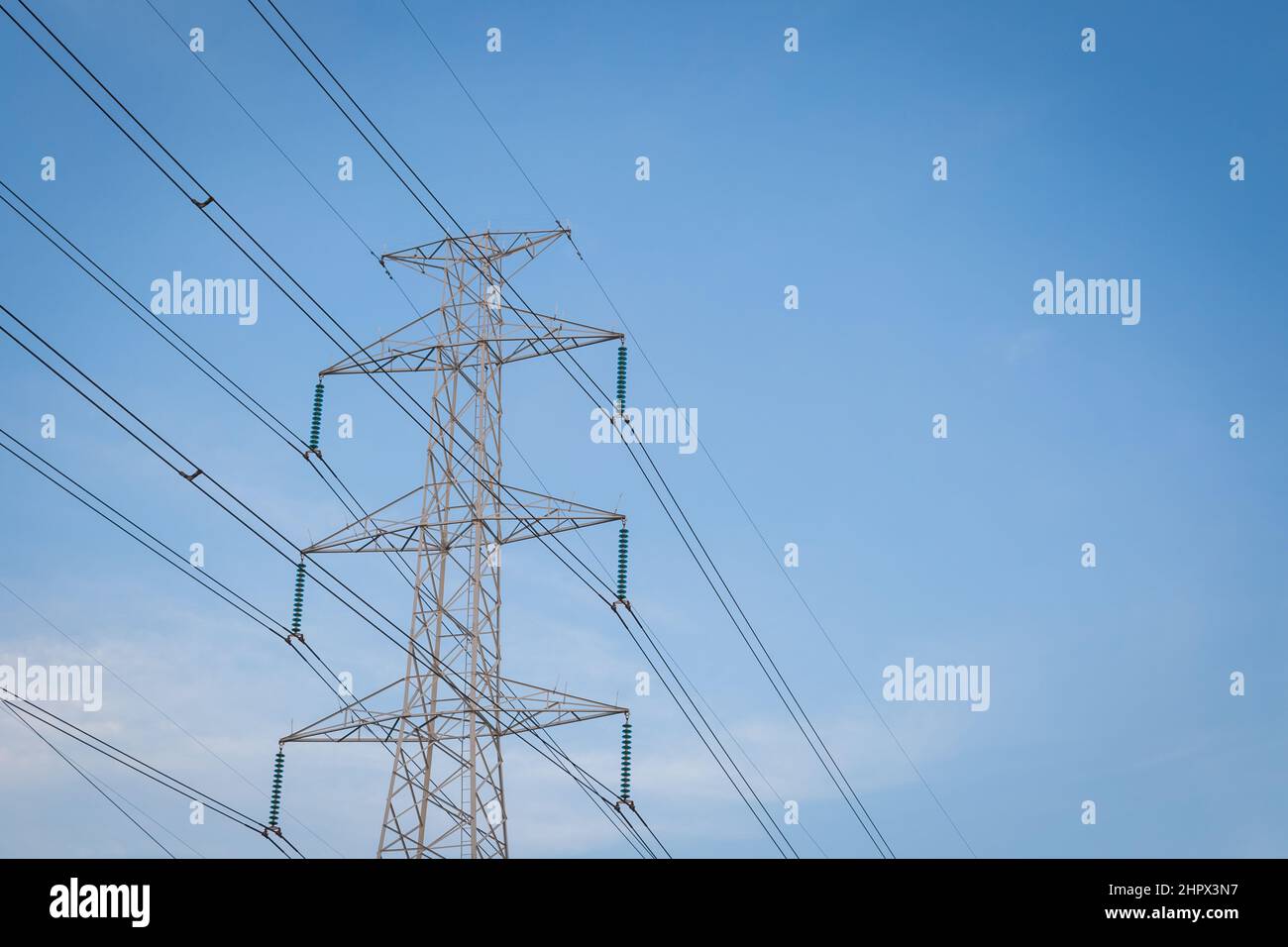 High voltage post tower with blue sky before sunset background Stock ...
