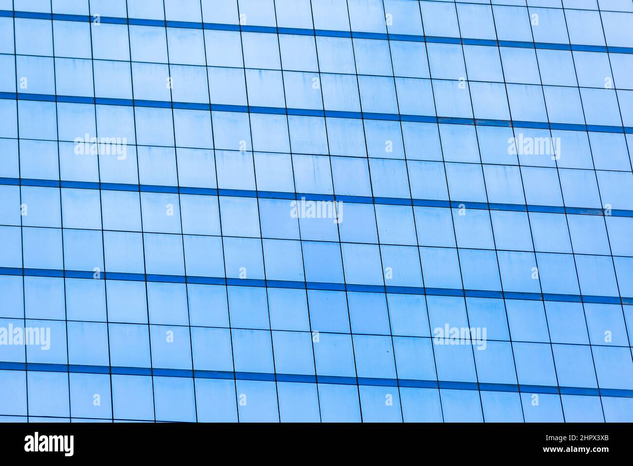 Blue glass windows of office building for background Stock Photo - Alamy