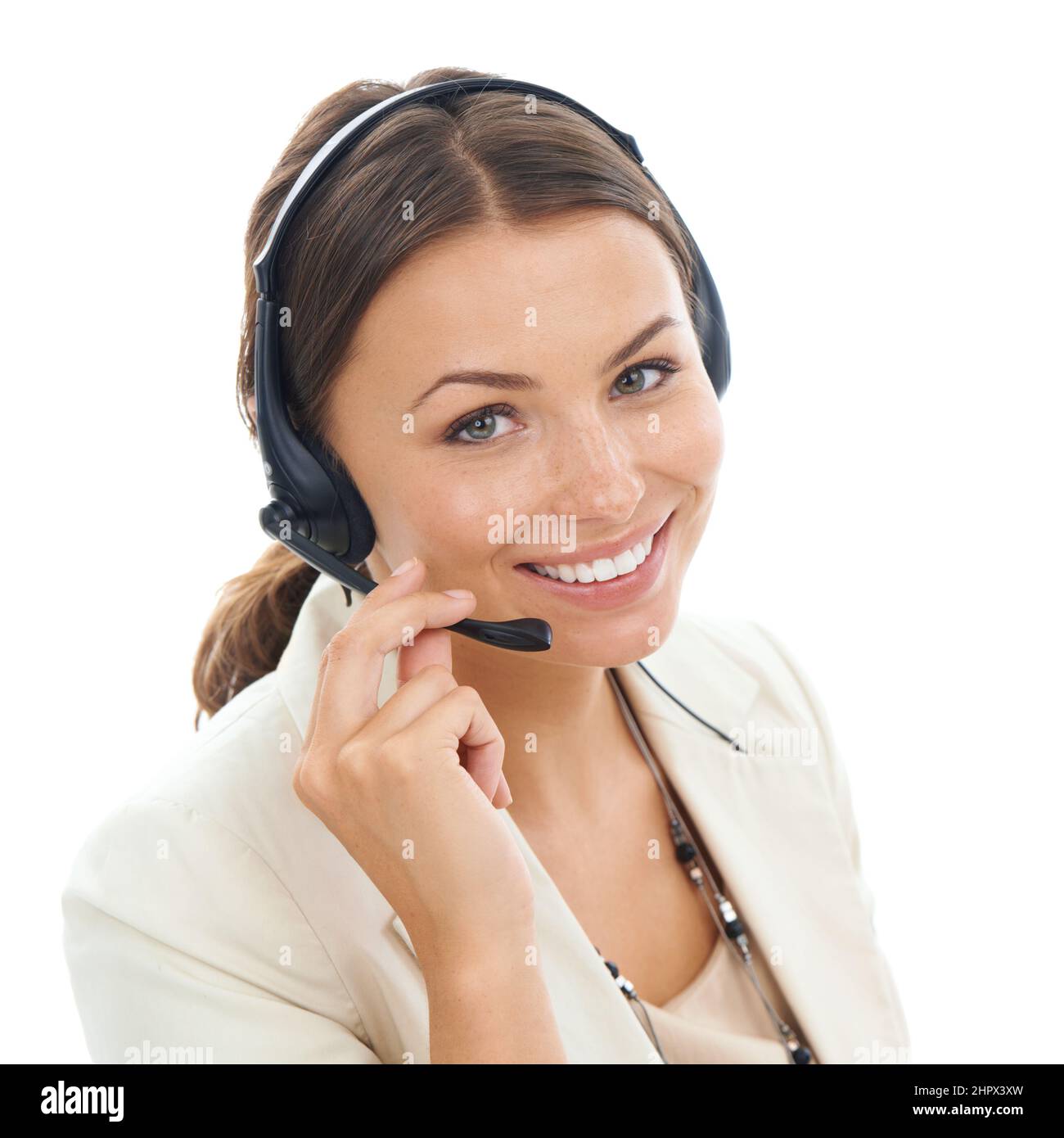 Assistance is her speciality. A beautiful young receptionist wearing a ...