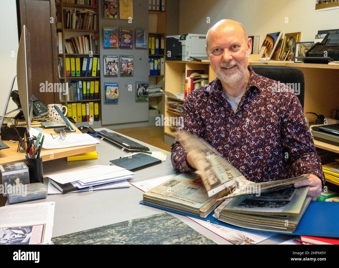 Bodenheim, Germany. 21st Feb, 2022. Michael Bonewitz leafs through the ...