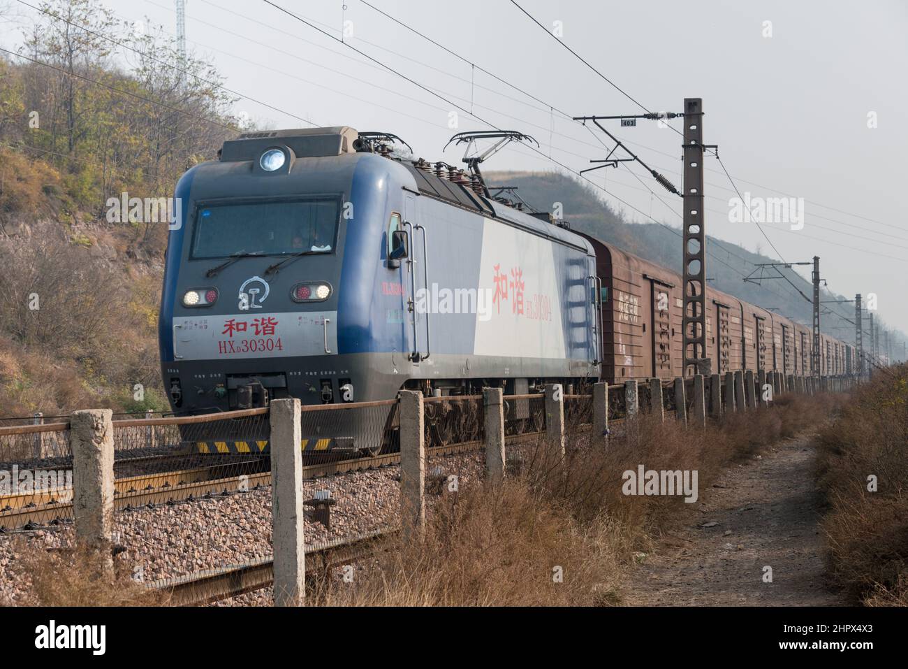 HENAN, CHINA - China Railways HXD3 electric locomotive in Luoyang, Henan, China. The locomotive ...