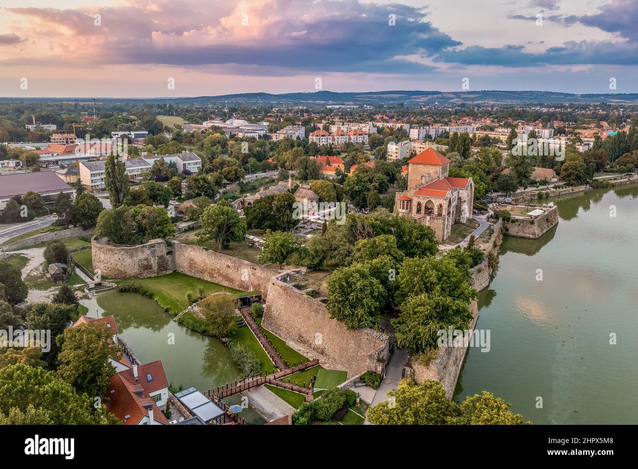 Aerial sunset view over the old lake of Tata with medieval castle ...