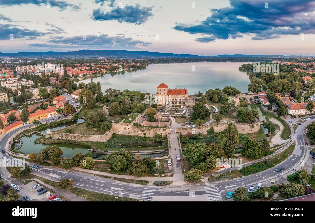 Aerial sunset view over the old lake of Tata with medieval castle ...