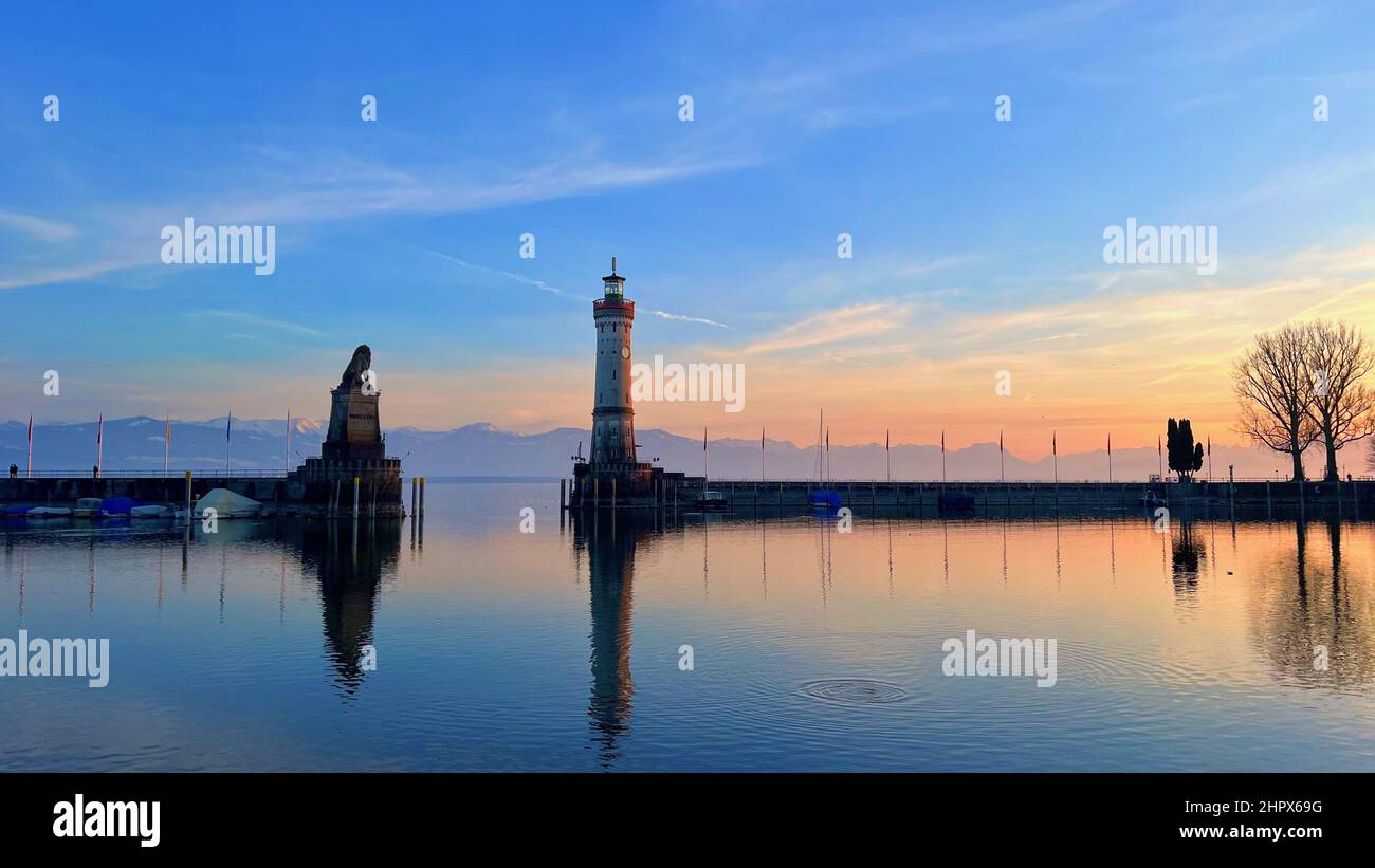 View of the sunset at the Lindau Port with the lighthouse and Bavarian ...