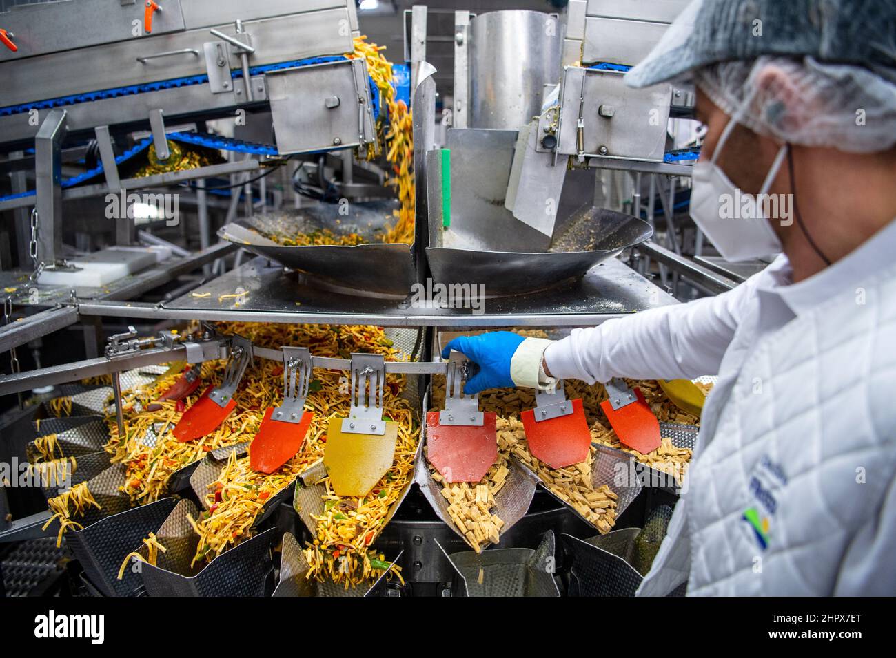 Bremerhaven, Germany. 23rd Feb, 2022. An employee works in Frosta's ...